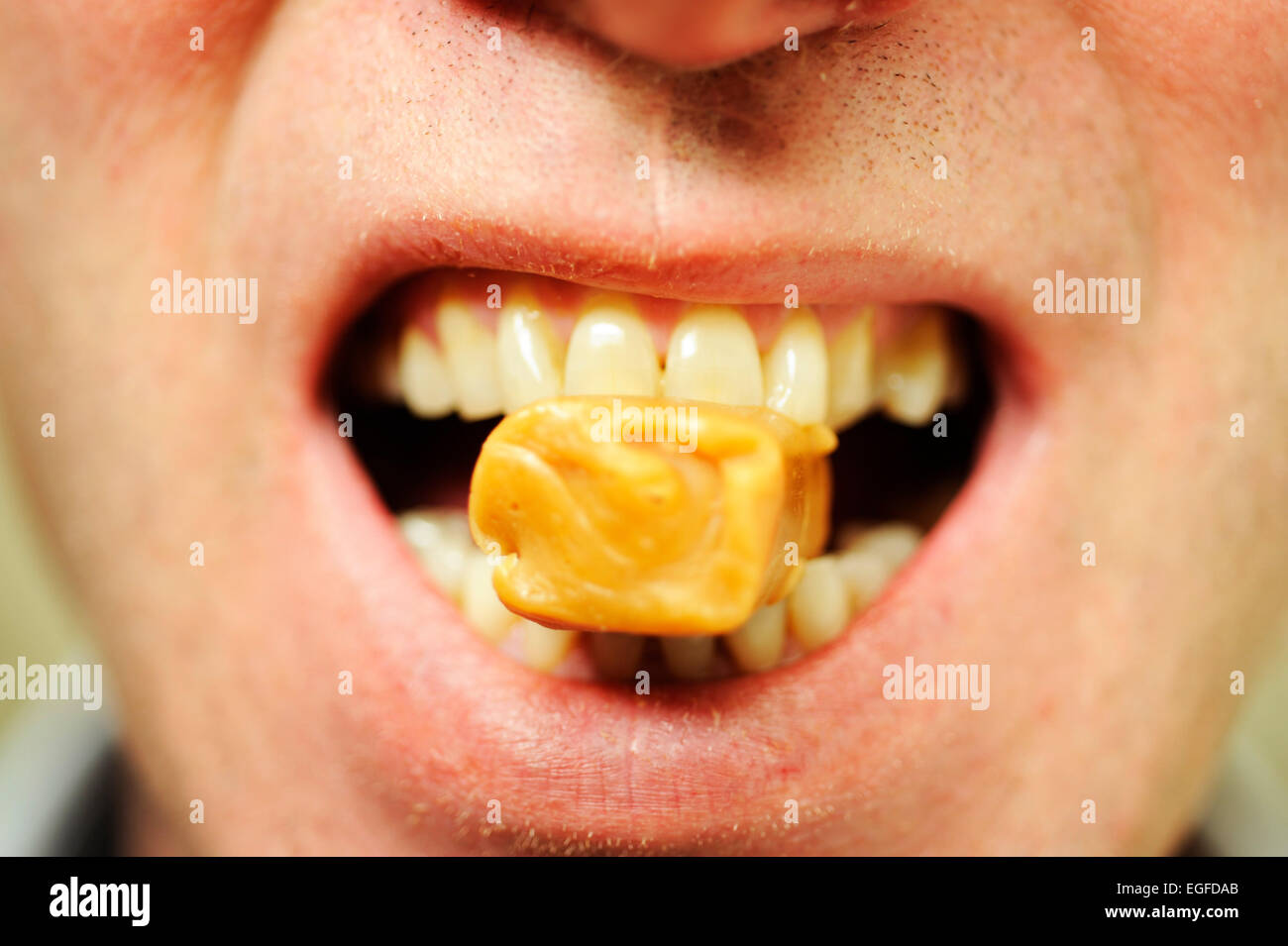 Male Eating Toffee Sweets Stock Photo - Alamy