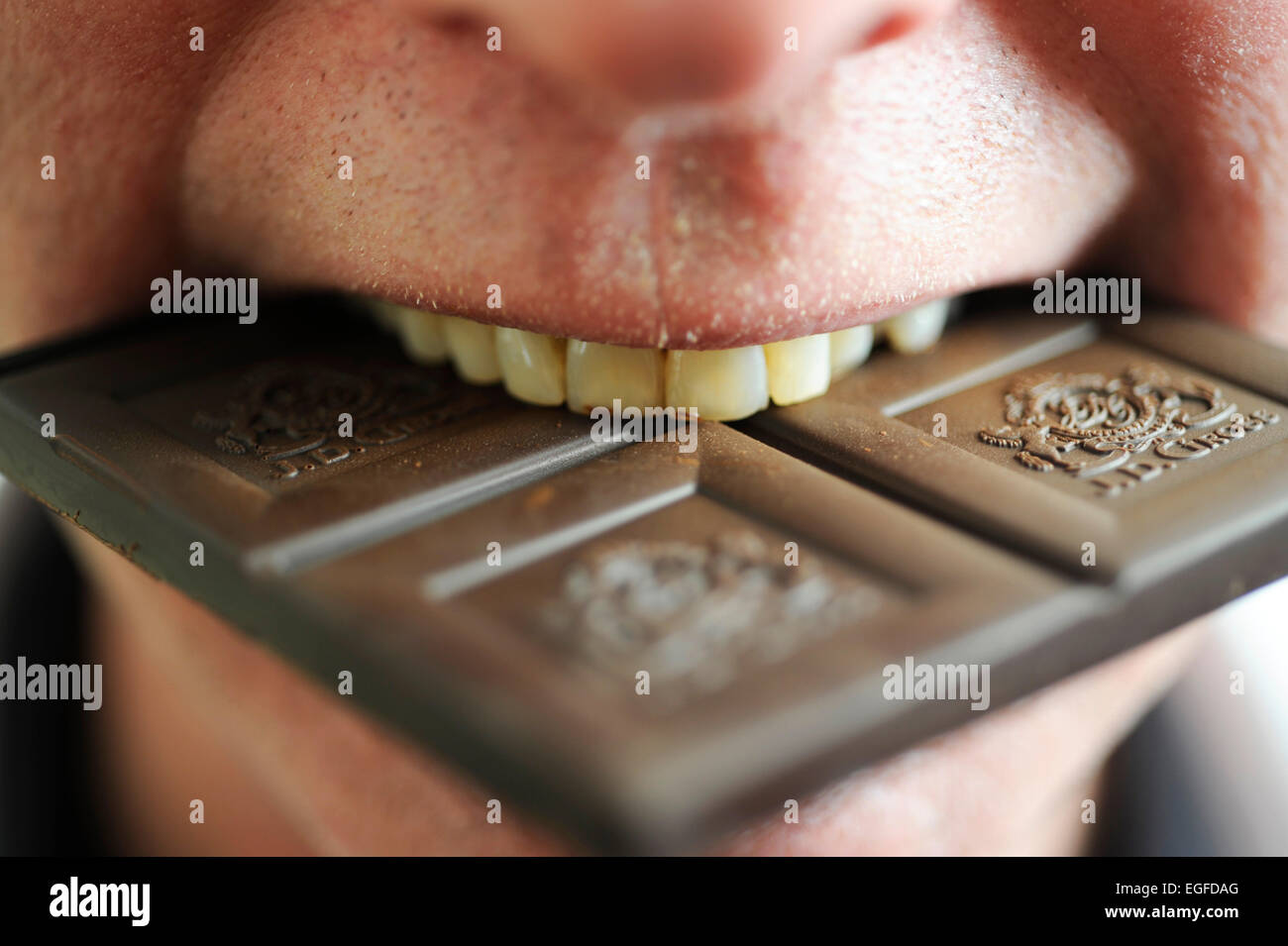 Male Eating Chocolate Stock Photo - Alamy