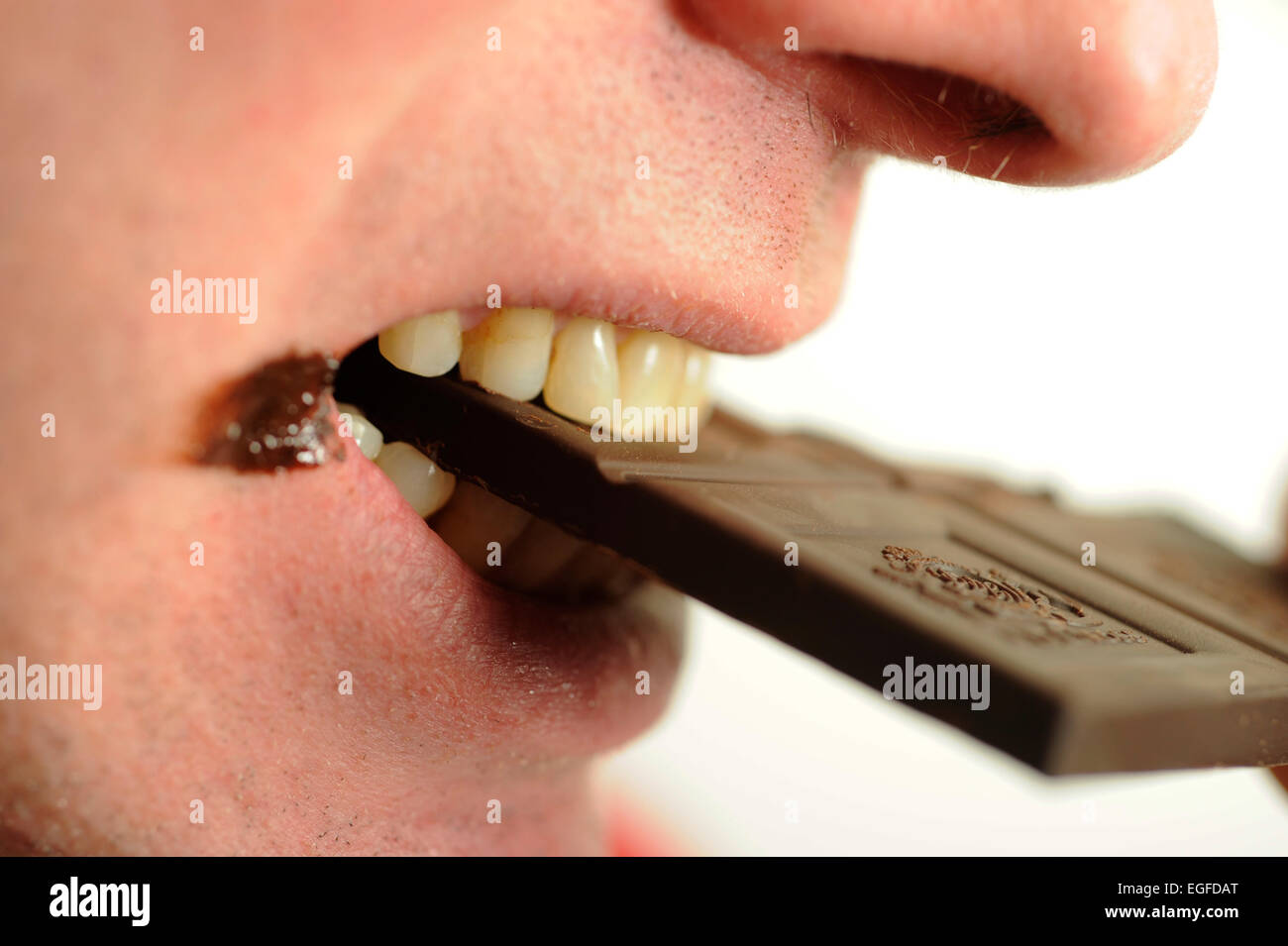 Male Eating Chocolate Stock Photo - Alamy
