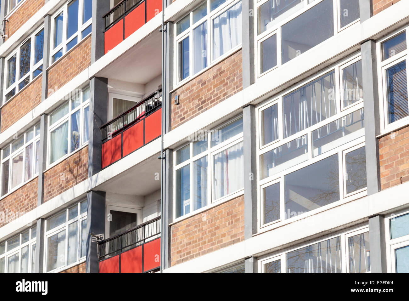 Detail from an apartment block showing windows and balconies ...