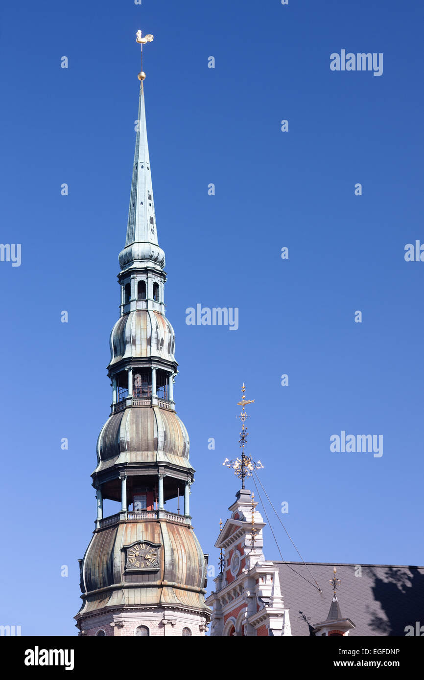 The spire of the Cathedral of St. Peter with a clock and a rooster ...