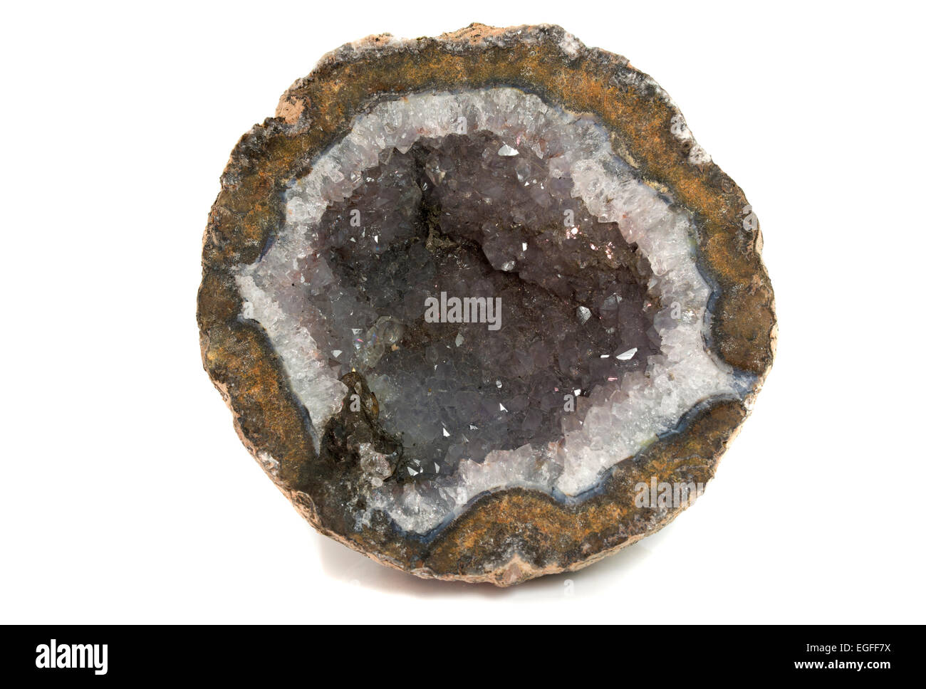 crystals in gem stone geode isolated on white Stock Photo - Alamy