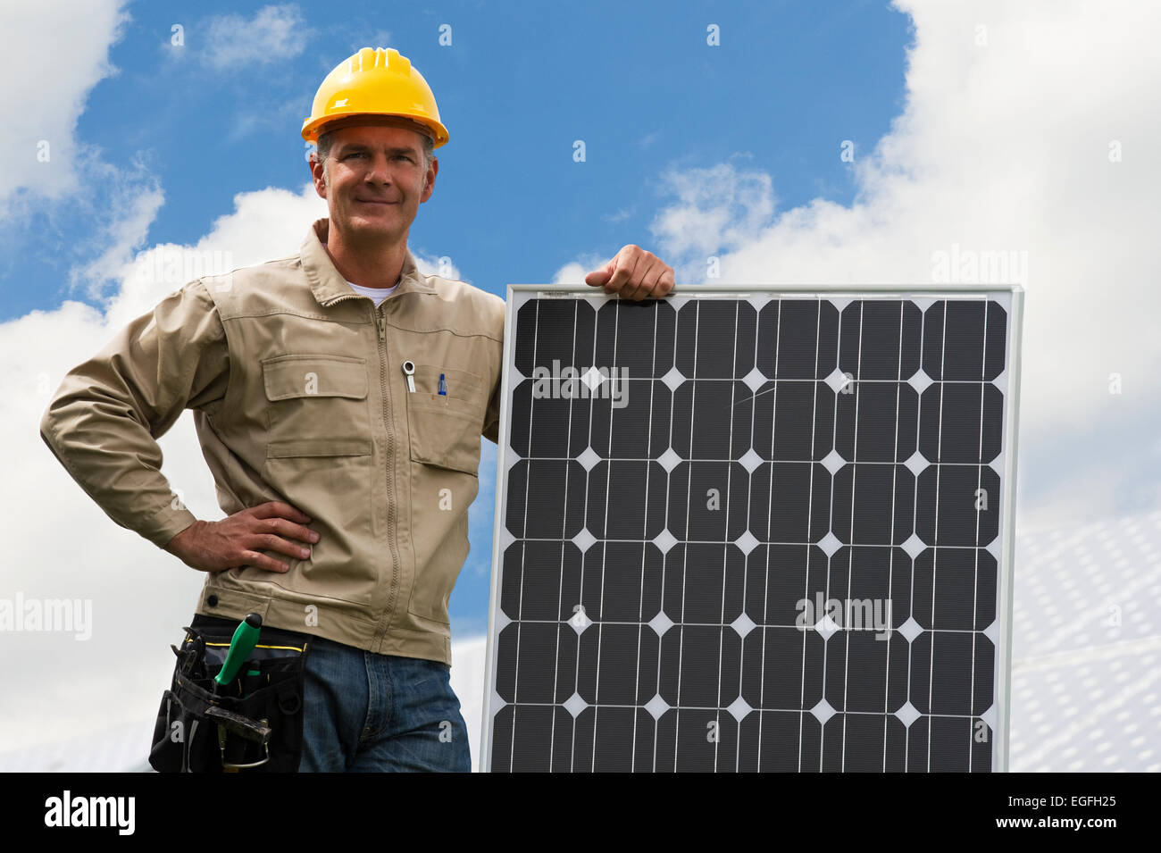 Technician with solar panel Stock Photo - Alamy
