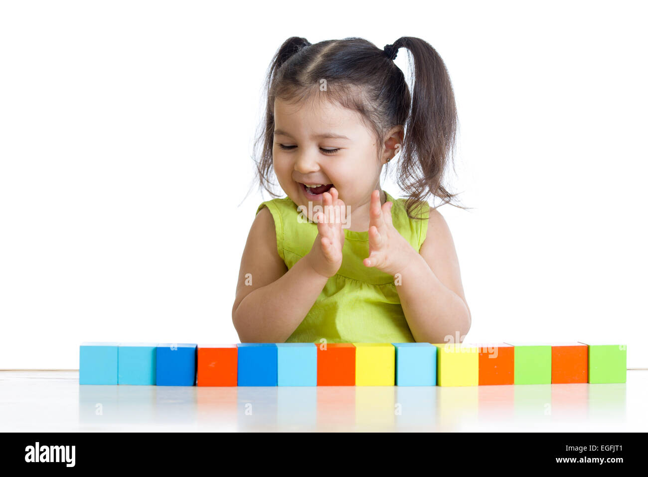 Little girl with toy blocks Stock Photo - Alamy