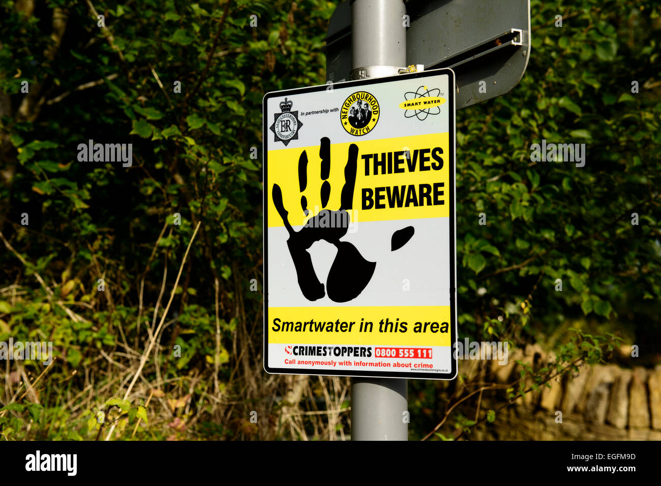 Warning sign to thieves, UK Stock Photo - Alamy