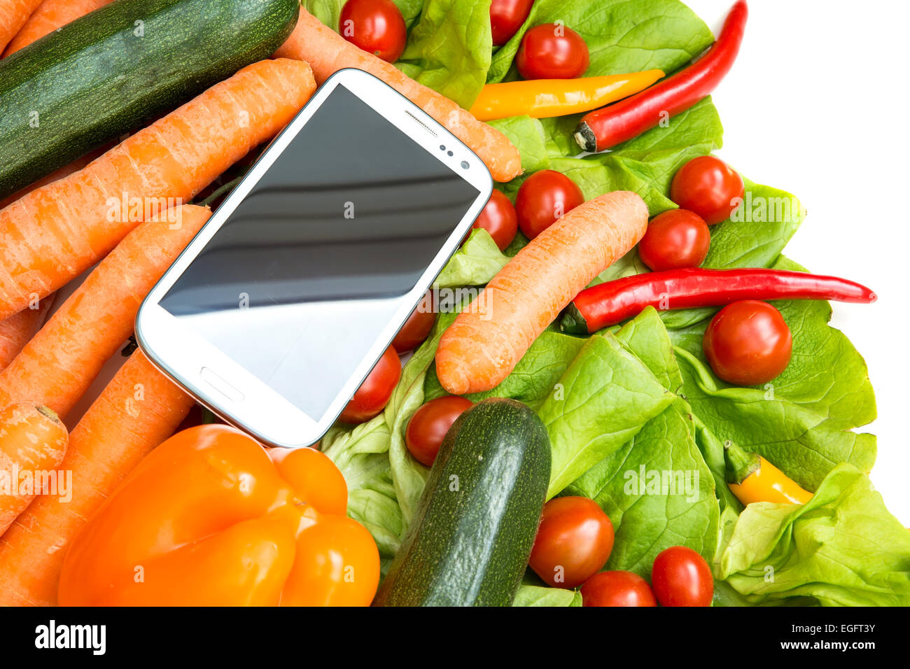 Various vegetables with a Smartphone Stock Photo - Alamy