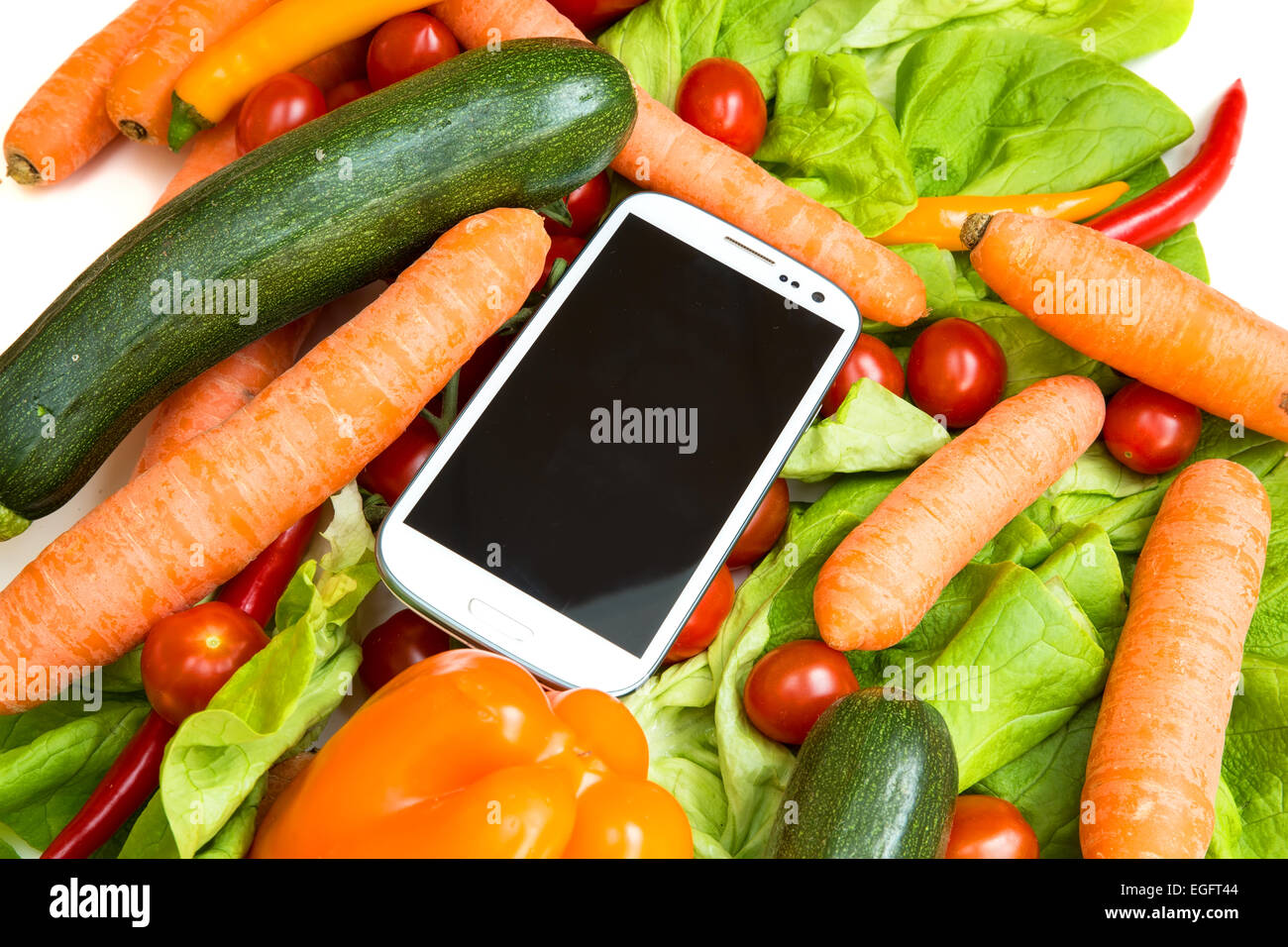 Various vegetables with a Smartphone Stock Photo - Alamy