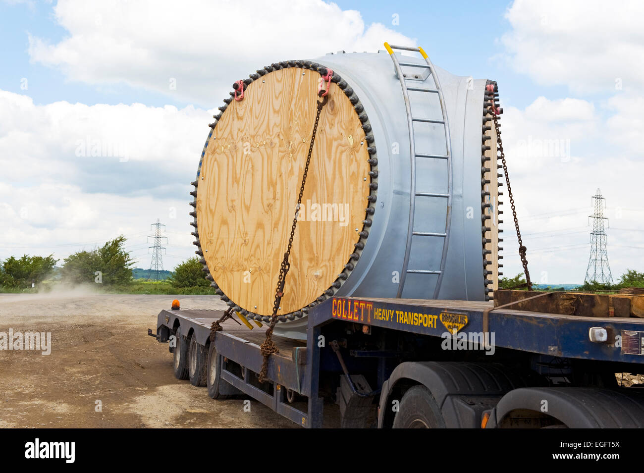 A low loader lorry delivering the hub of a wind turbine Stock Photo - Alamy