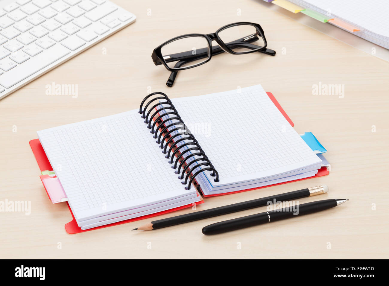 Office table with computer, supplies and glasses Stock Photo - Alamy
