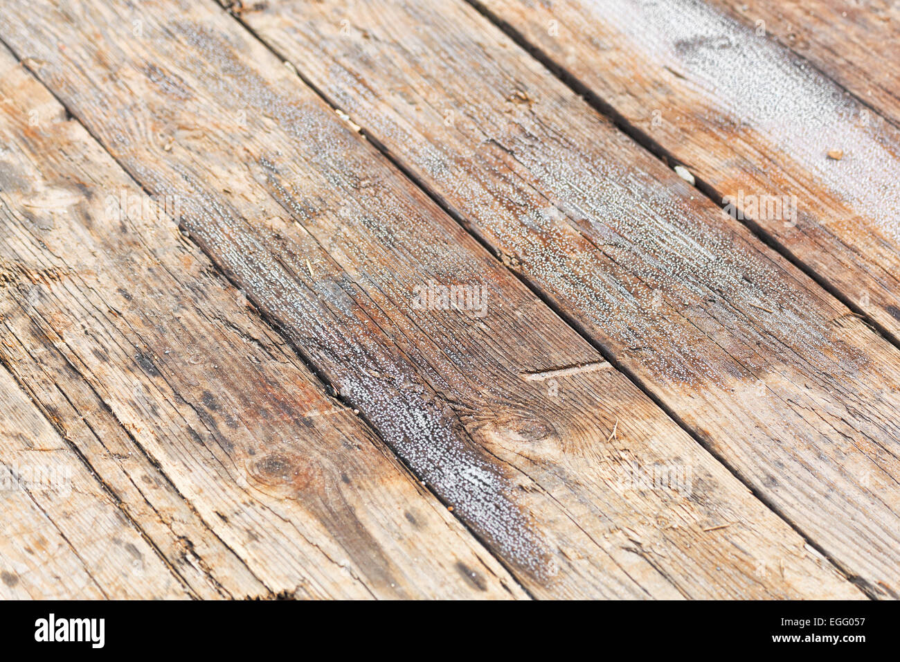 Old stained boards on a flatbed trailer covered with frost Stock Photo ...