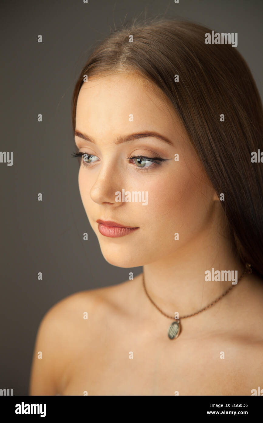 Portrait of a teenage girl looking off to the left Stock Photo - Alamy
