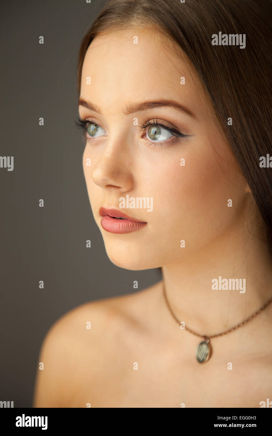 Portrait of a teenage girl looking off to the left Stock Photo - Alamy