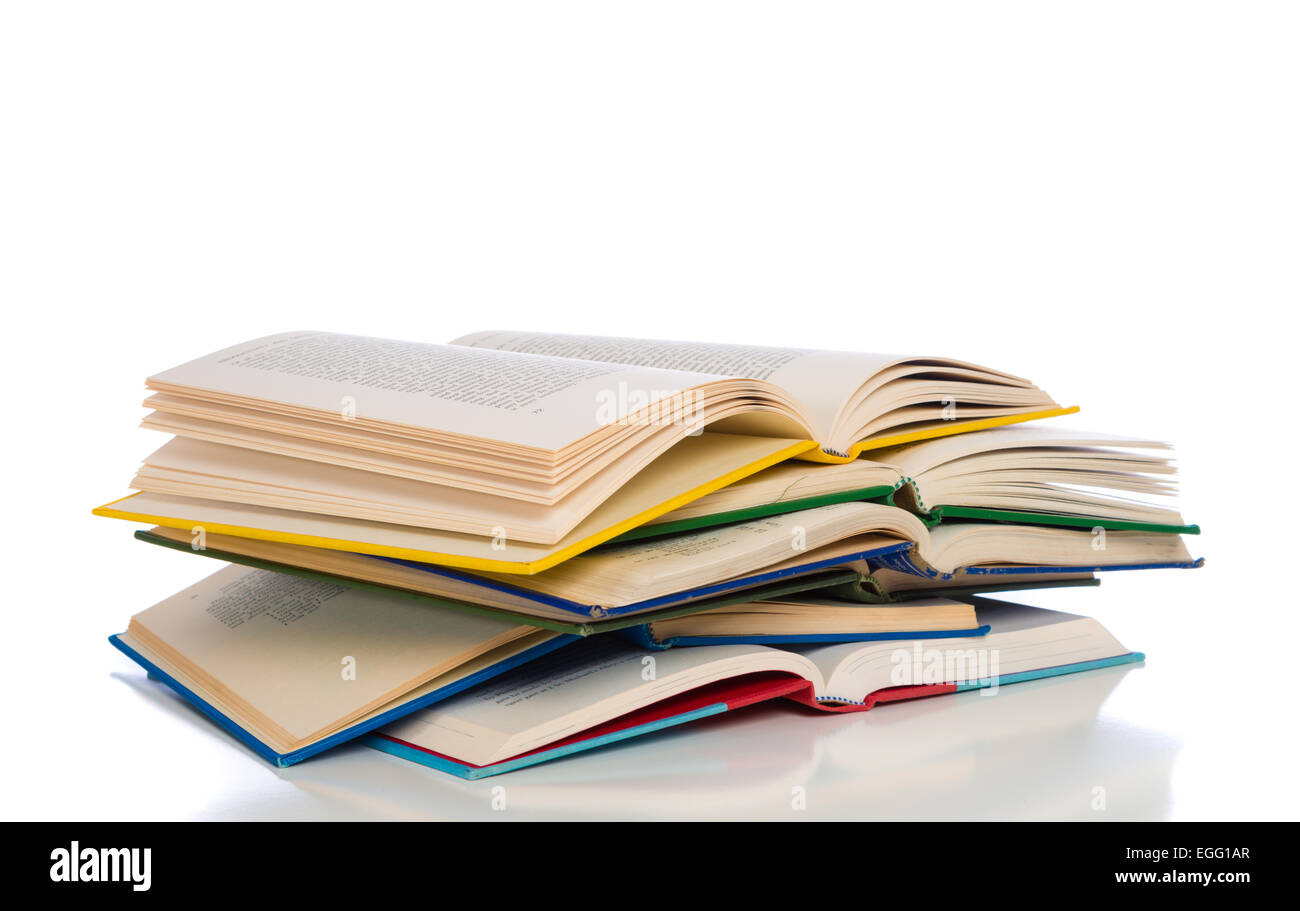 A stack of open, colorful book with a white background Stock Photo - Alamy