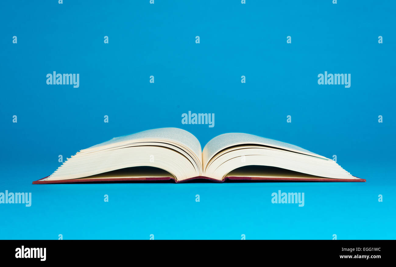 Open book blue background hi-res stock photography and images - Alamy