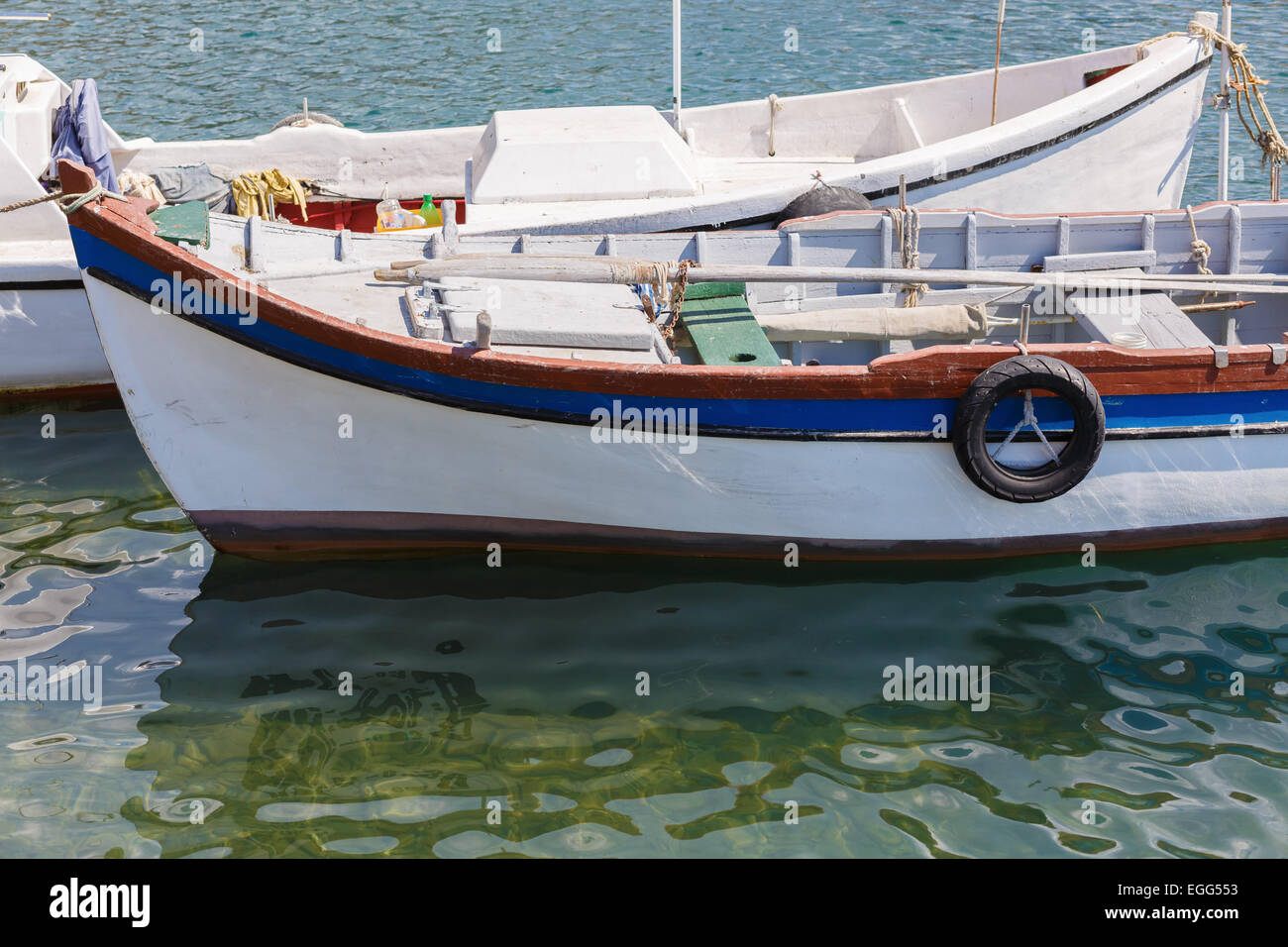 Two old wooden painted white rowboat closeup Stock Photo - Alamy