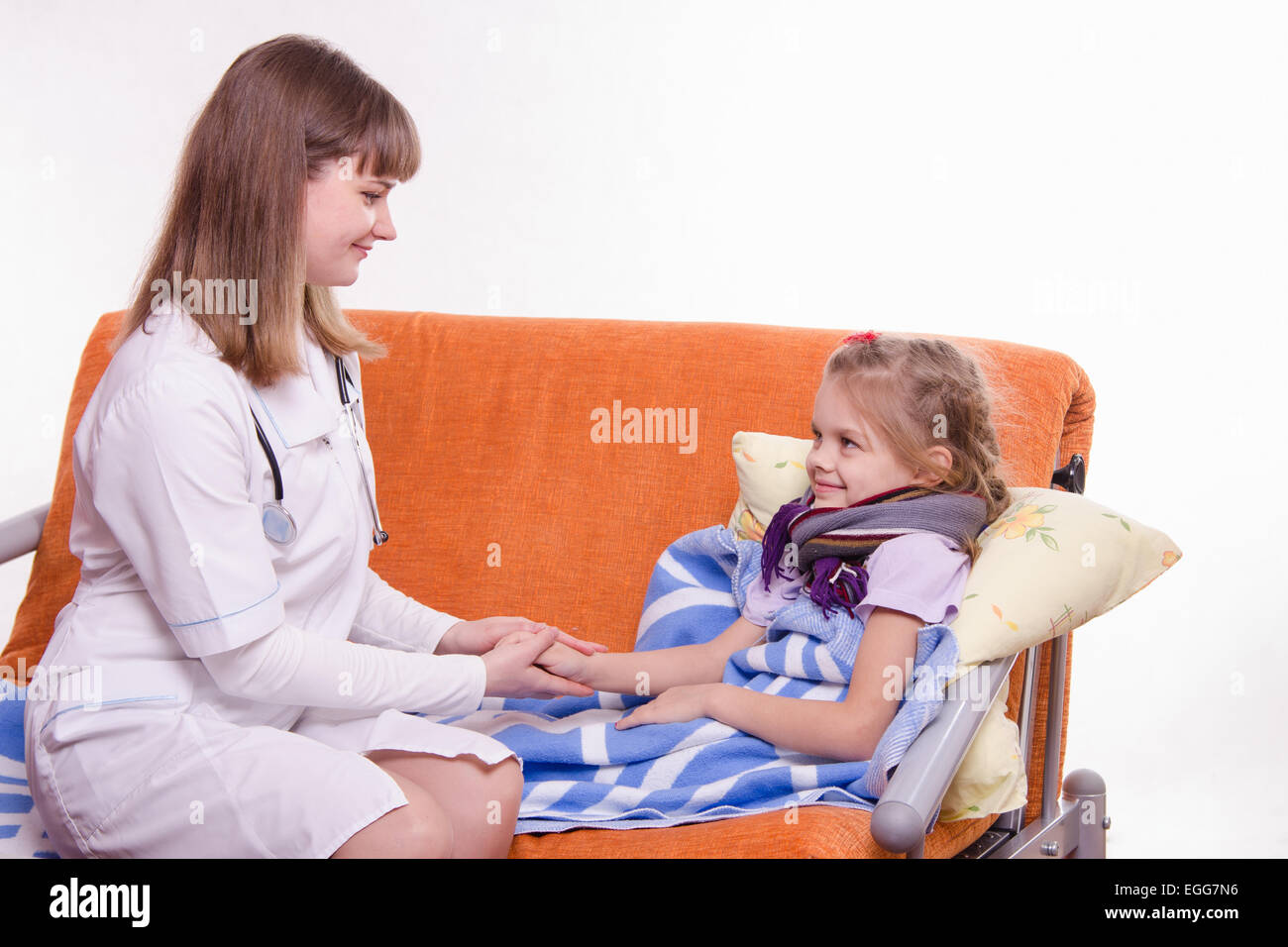 Doctor pediatrician examines a sick child at home Stock Photo - Alamy