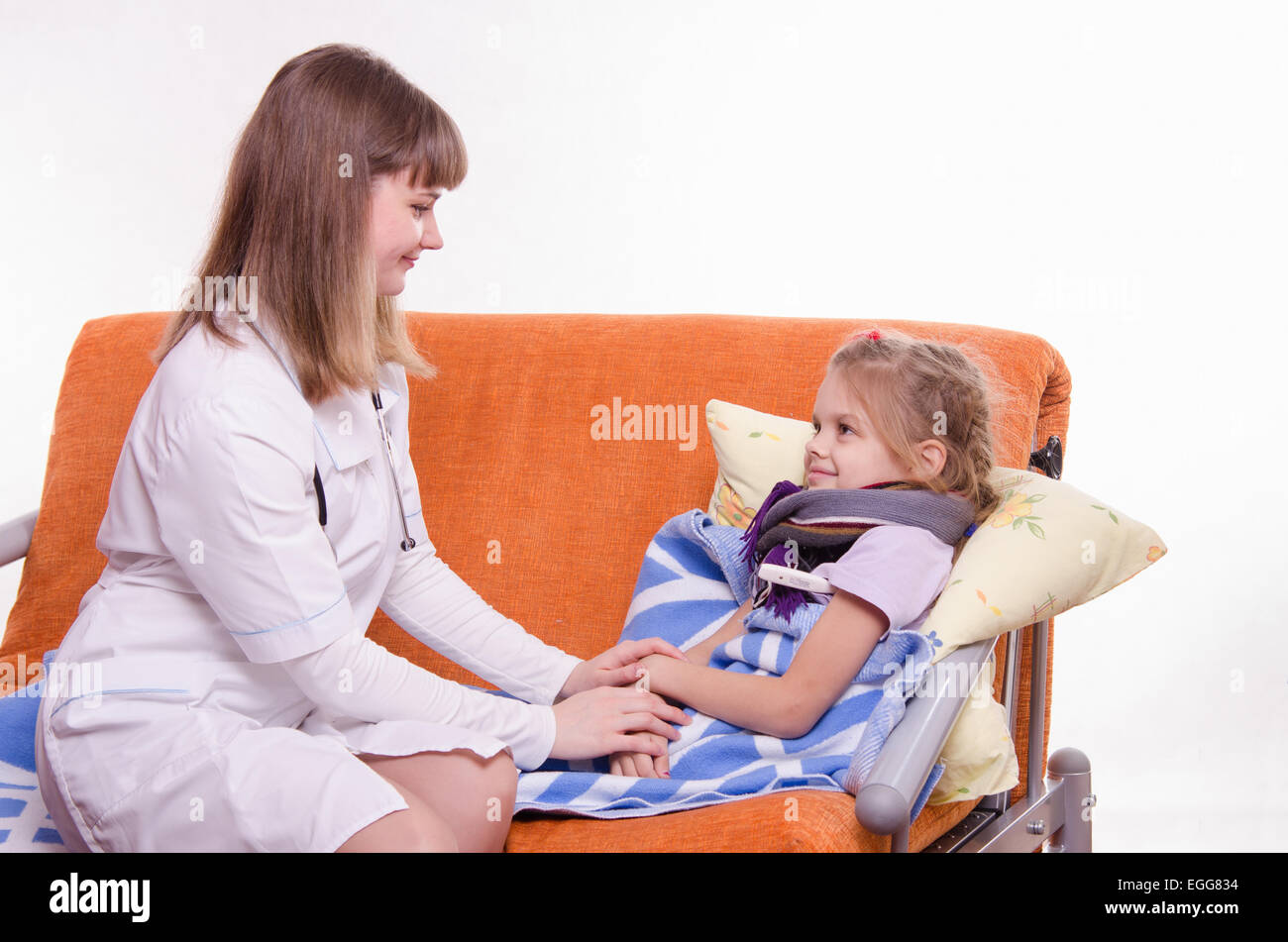 Doctor pediatrician examines a sick child at home Stock Photo - Alamy