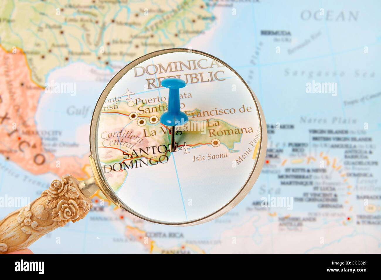 Blue tack on map of the Caribbean with magnifying glass looking in on ...