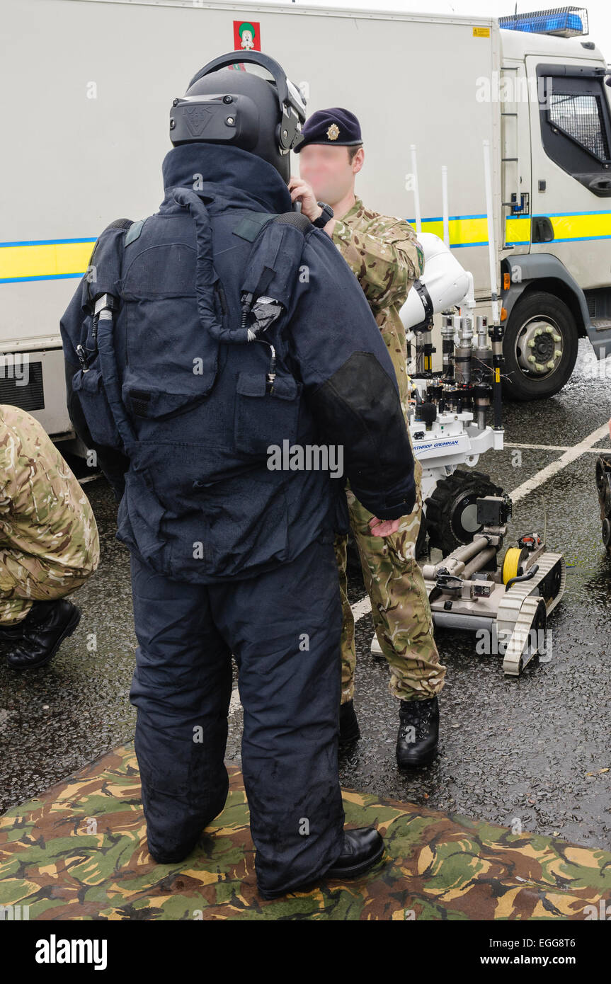 Ammunition Technical officer wearing a bomb-proof suit prepares to ...