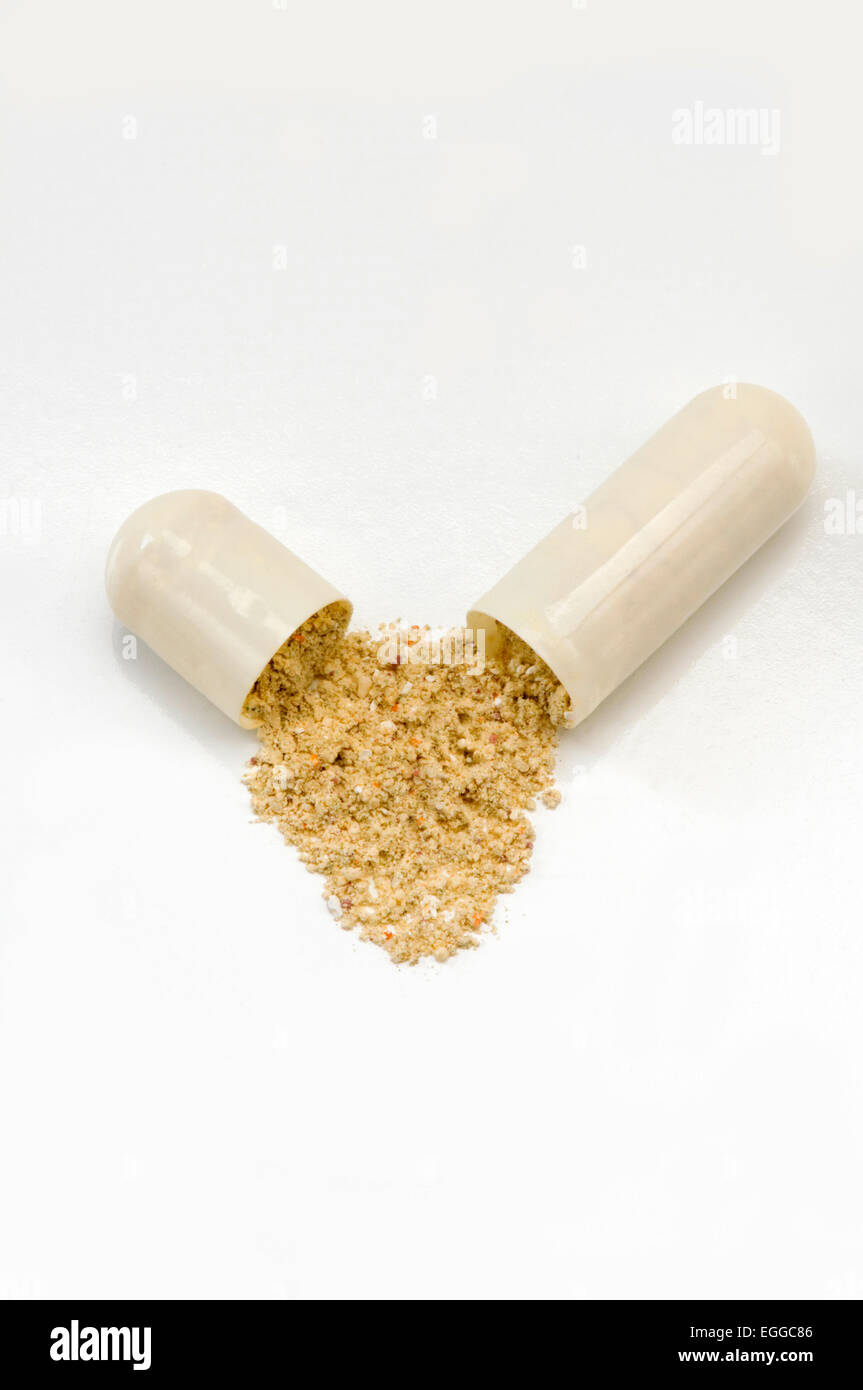 Opened drug Capsule on white Stock Photo - Alamy