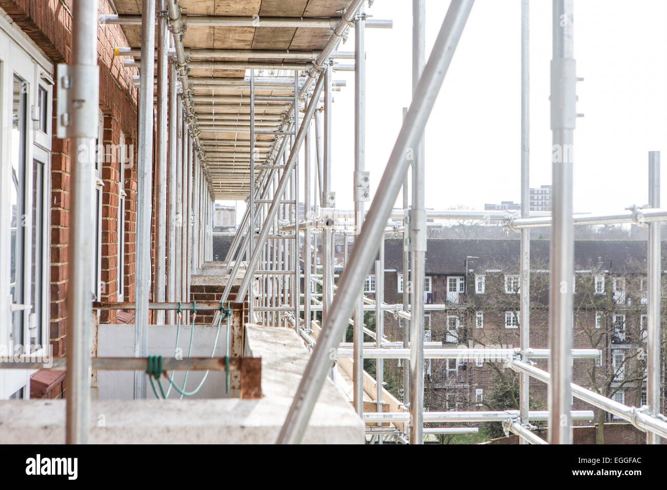 view through scaffolding on a block of flats Stock Photo - Alamy