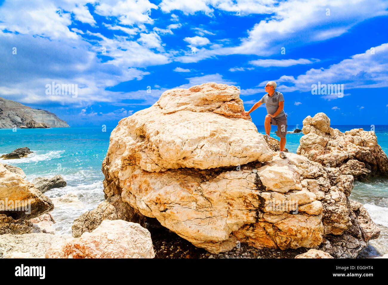 Retired older man on rocks on Cyprus beach in summer Stock Photo - Alamy