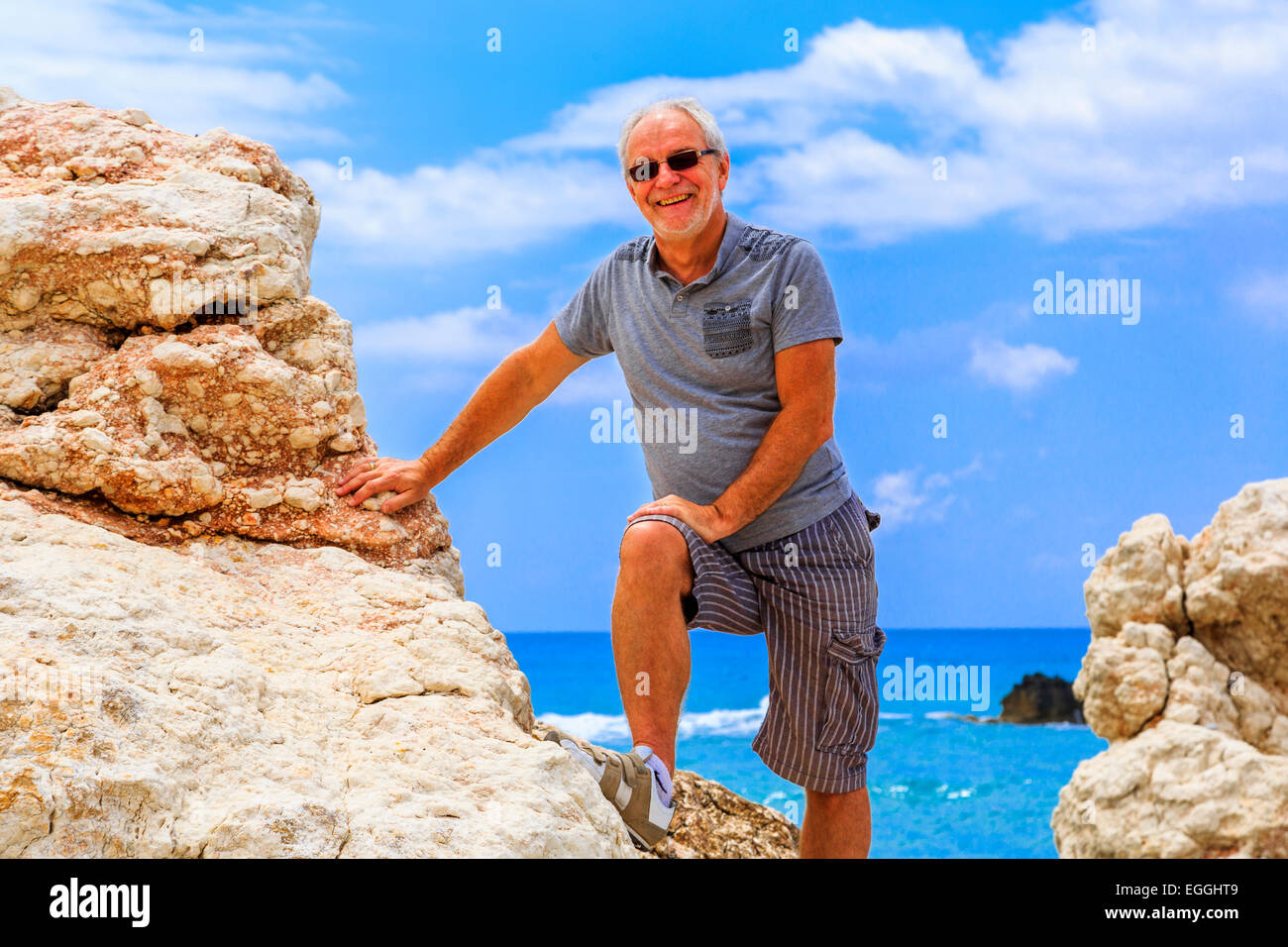 Retired older man on rocks on Cyprus beach in summer Stock Photo - Alamy