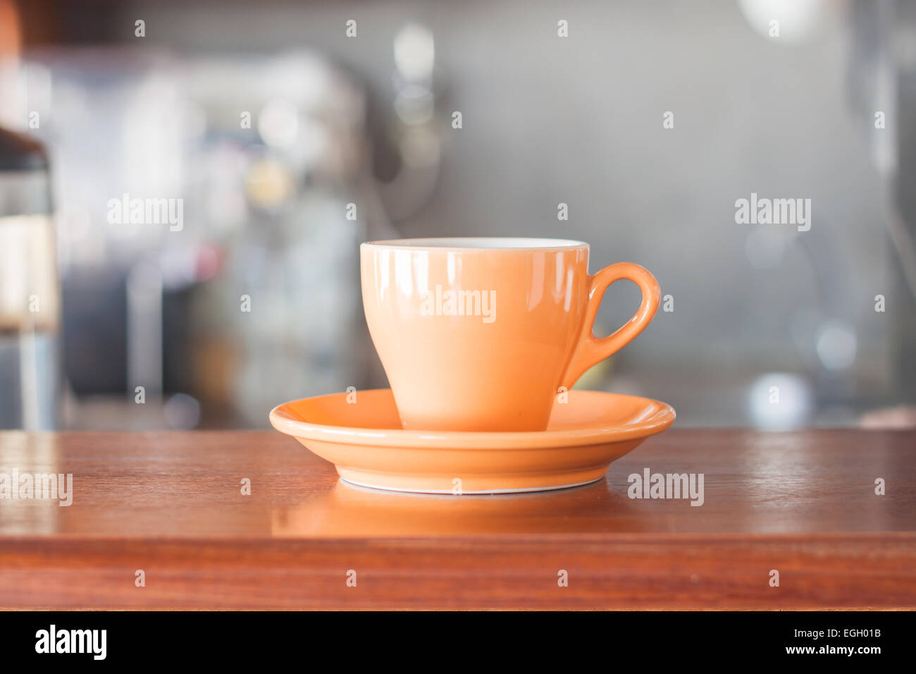 Orange coffee cup in coffee shop, stock photo Stock Photo - Alamy