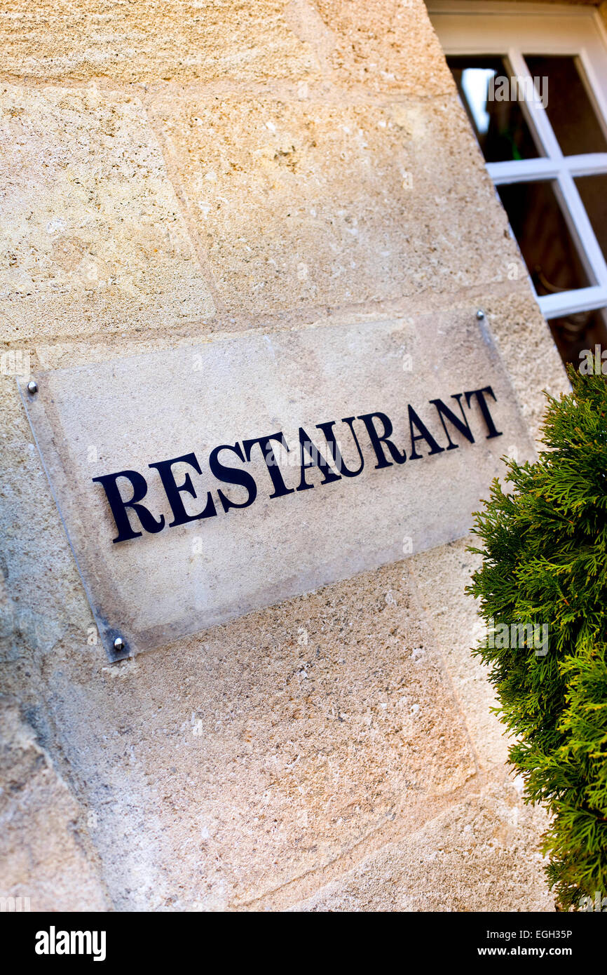 French restaurant sign on a stoned wall Stock Photo - Alamy