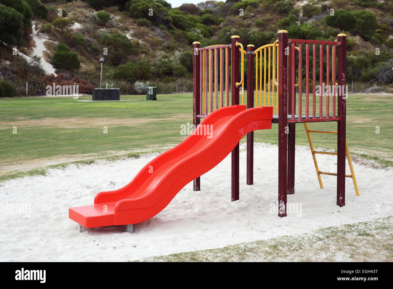 Children's playground equipment comprising a slide, walking bridge and ...