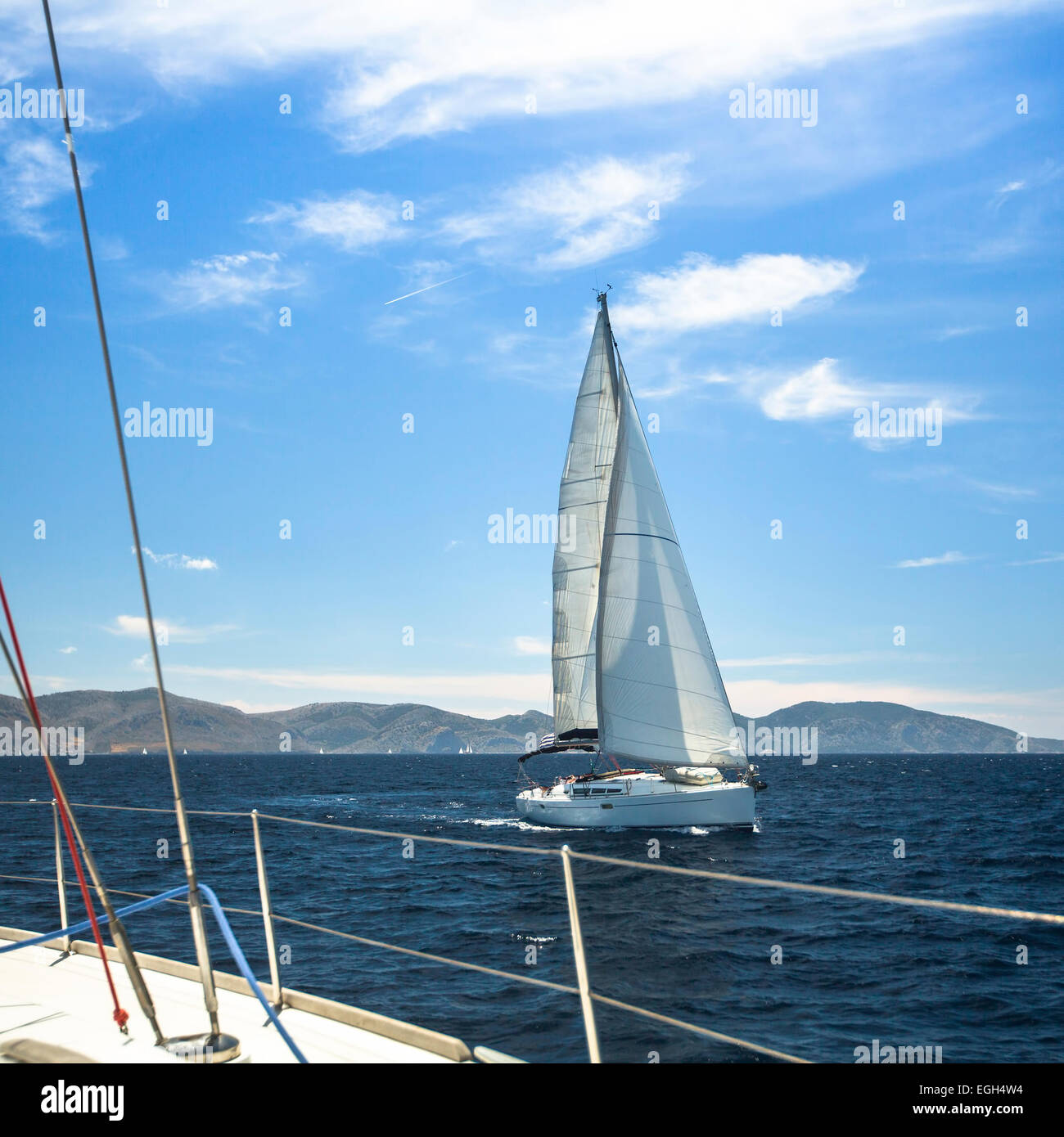 Ship yachts with white sails in the open Sea. Sailing. Luxury boats ...
