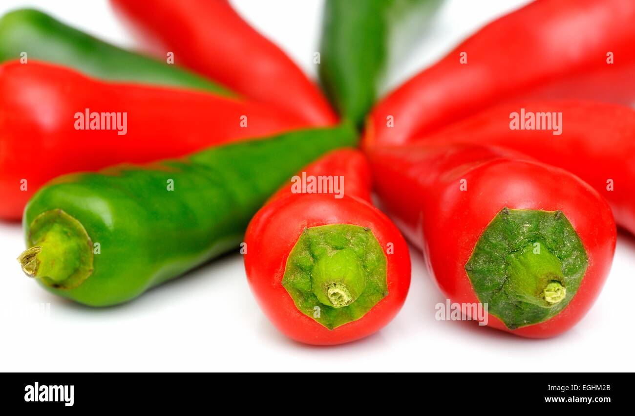 Mixed chili peppers on a white background Stock Photo - Alamy