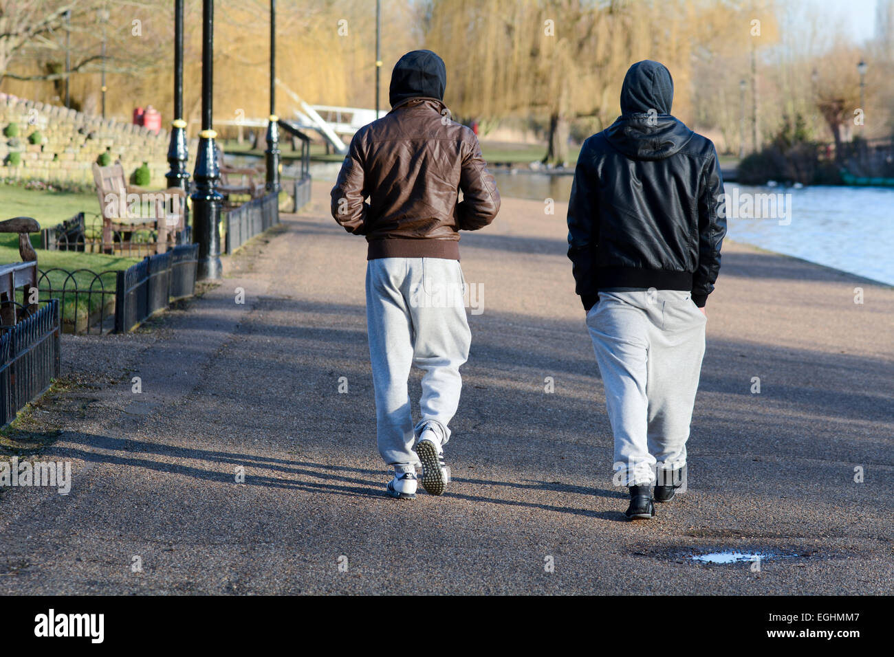 Two young men in tracksuits walking along the Embankment, Bedford ...