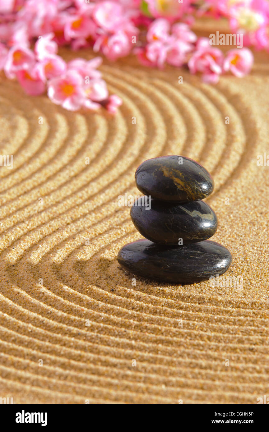 Japanese ZEN garden with stacked stones in sand Stock Photo - Alamy