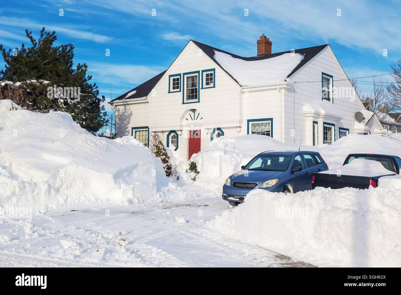 Snow piled up around a North American home after a snow storm Stock ...