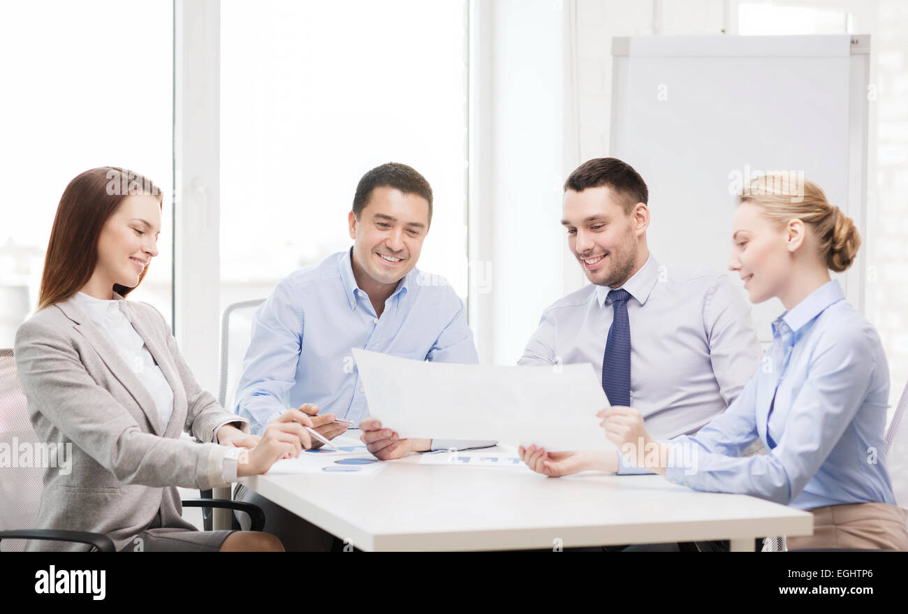 smiling business team having discussion in office Stock Photo - Alamy