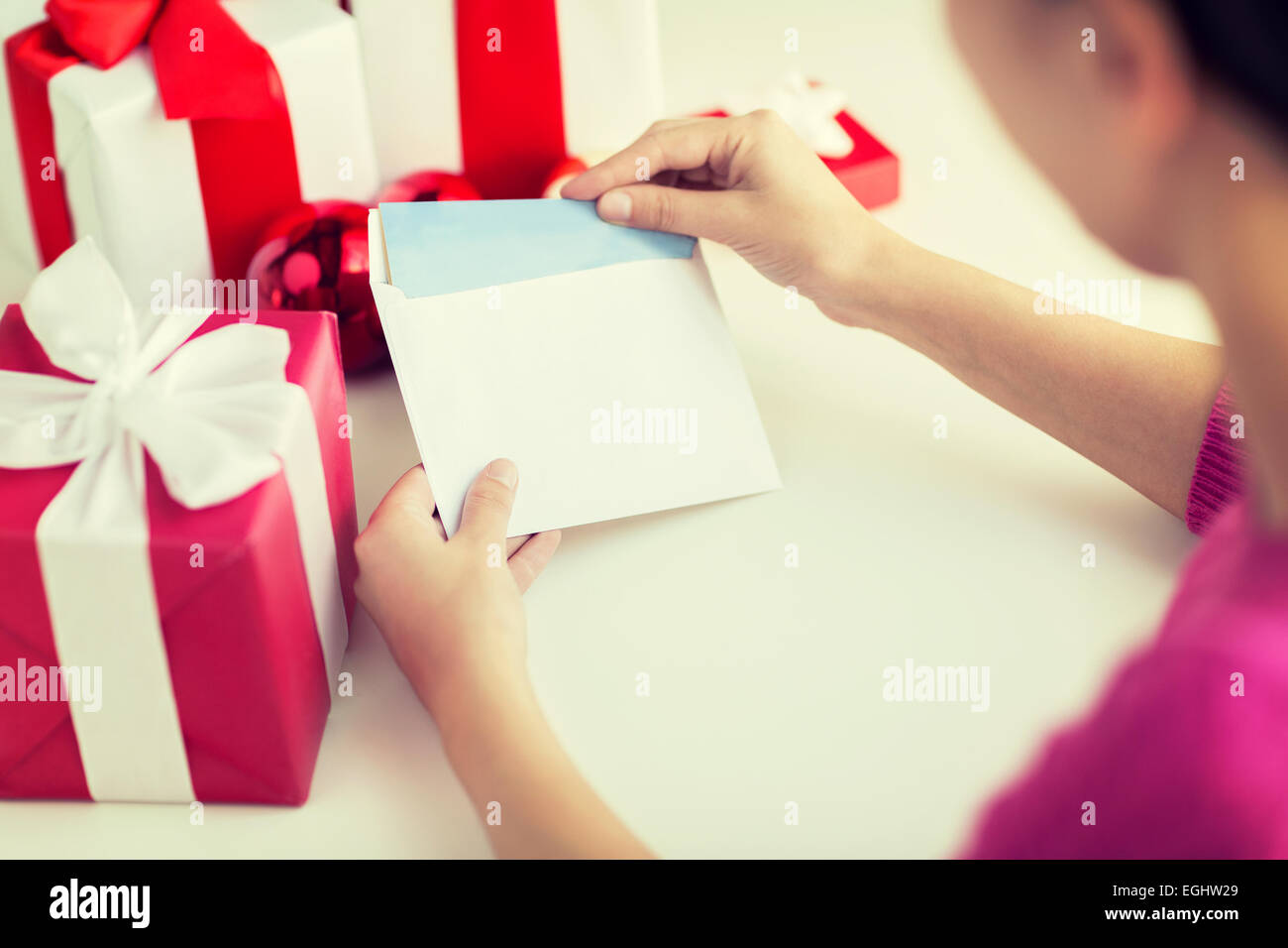 close up of woman with letter and presents Stock Photo - Alamy