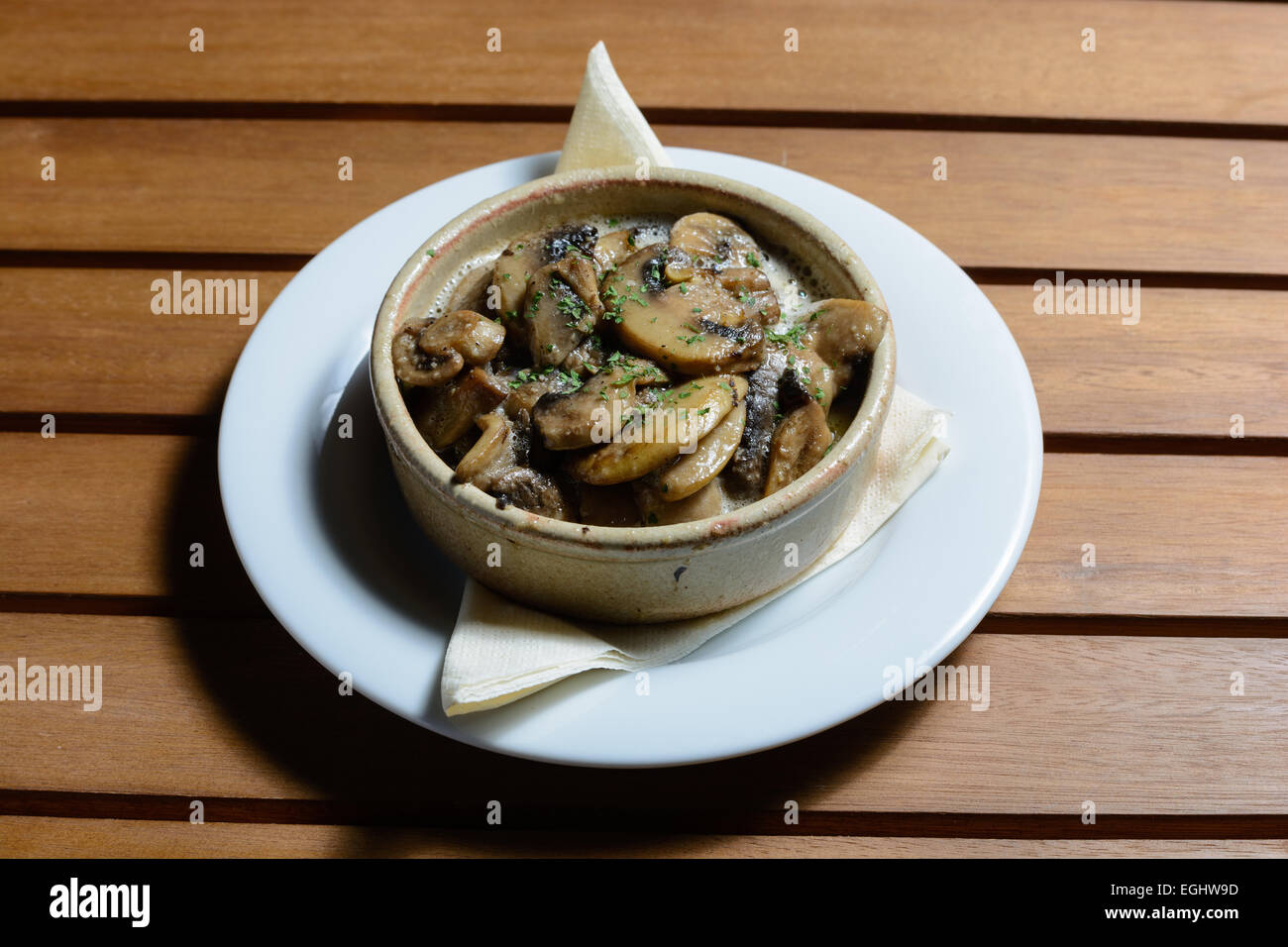 Ajillo. Mushrooms cooked in olive oil and white wine, and flavored with ...