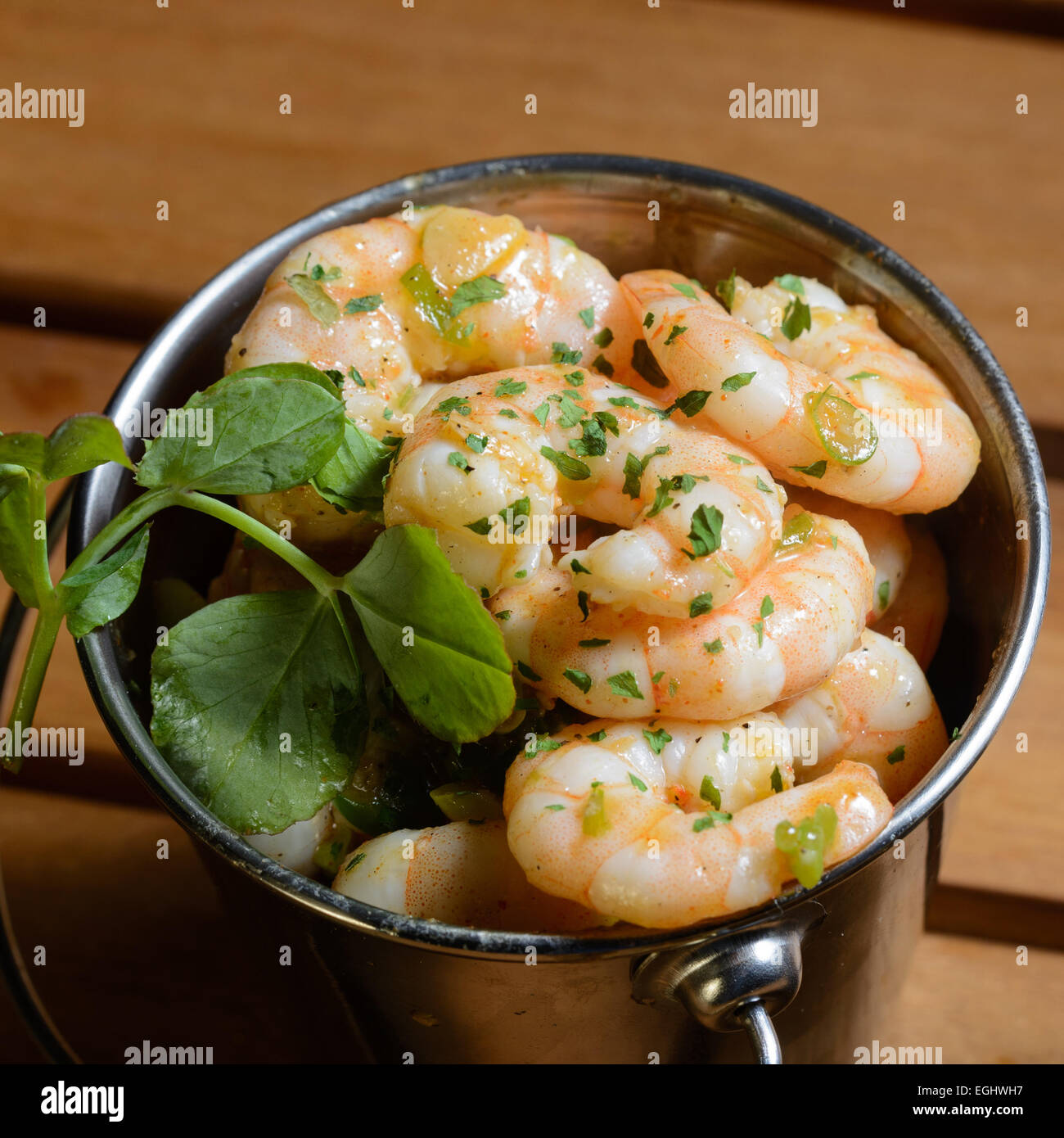 Tiger Prawns cooked with Garlic and Chilli. Served in a bucket shape ...