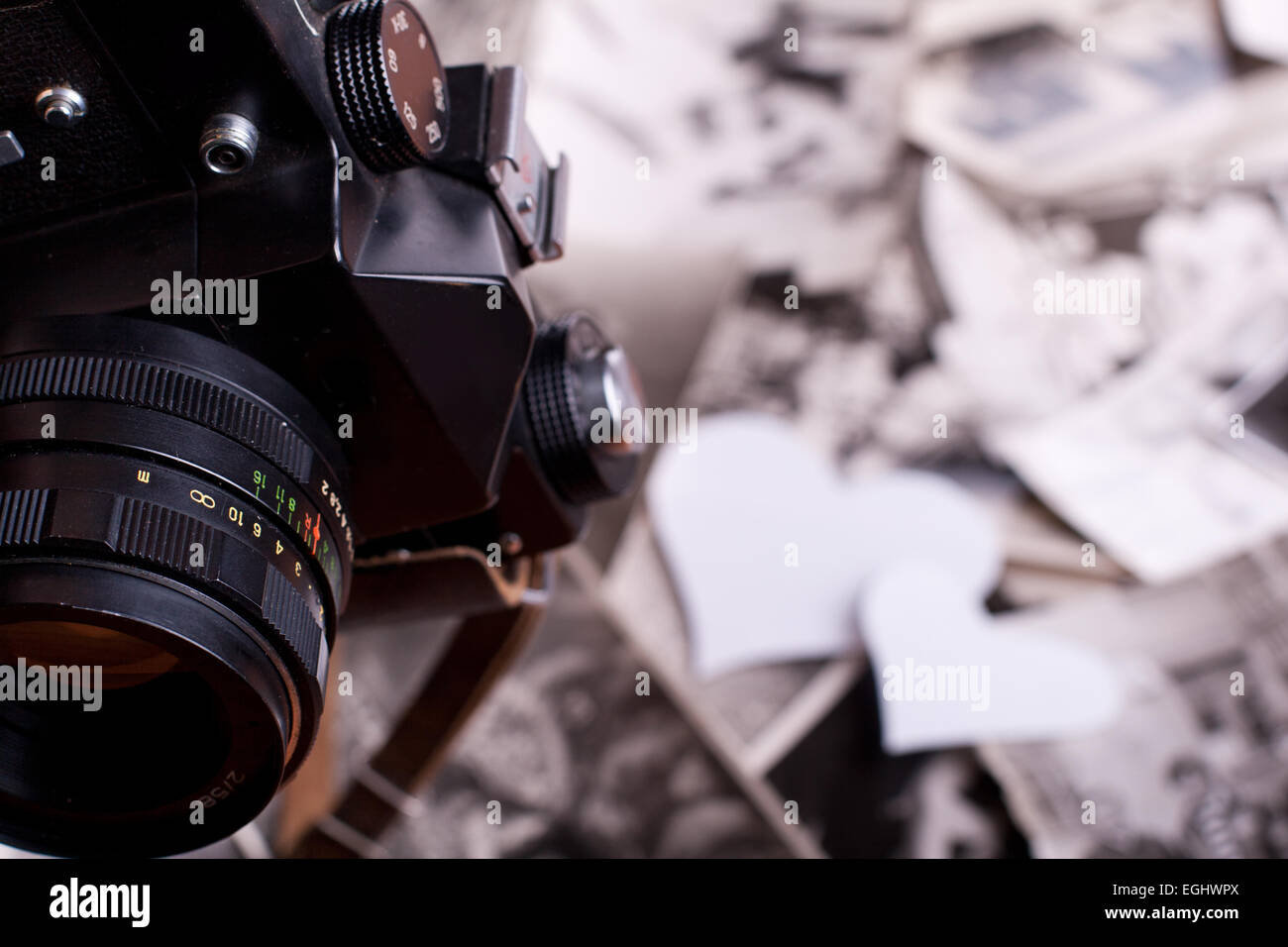 old camera close up and black & white photographs on background with ...