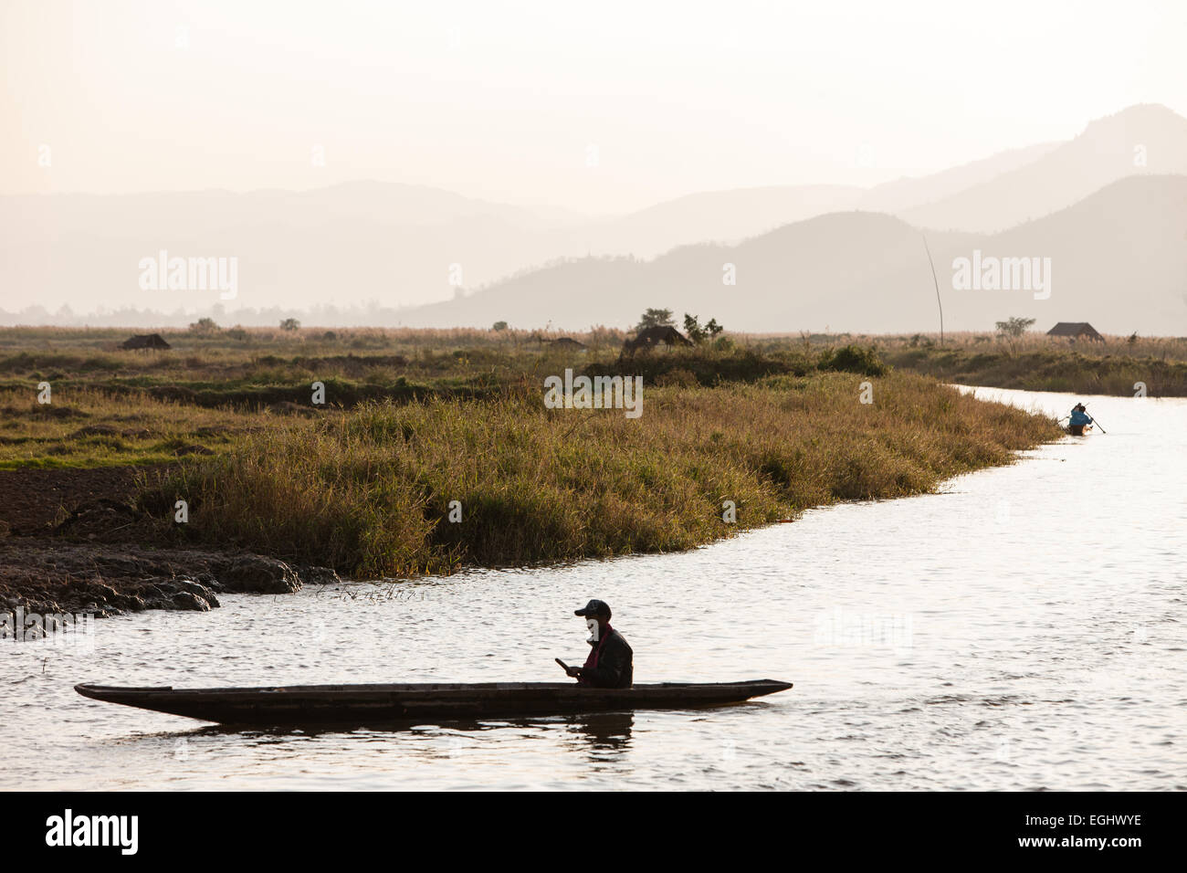 Canoe boat,longboat,long tailed engined boat on waterway canal near ...