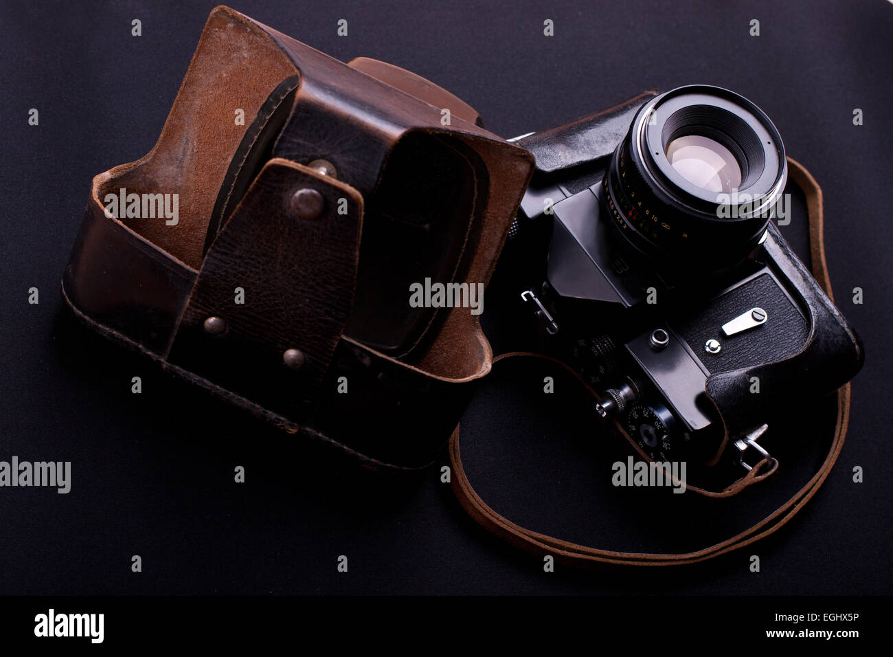 old Soviet camera with leather pouch on black background Stock Photo ...