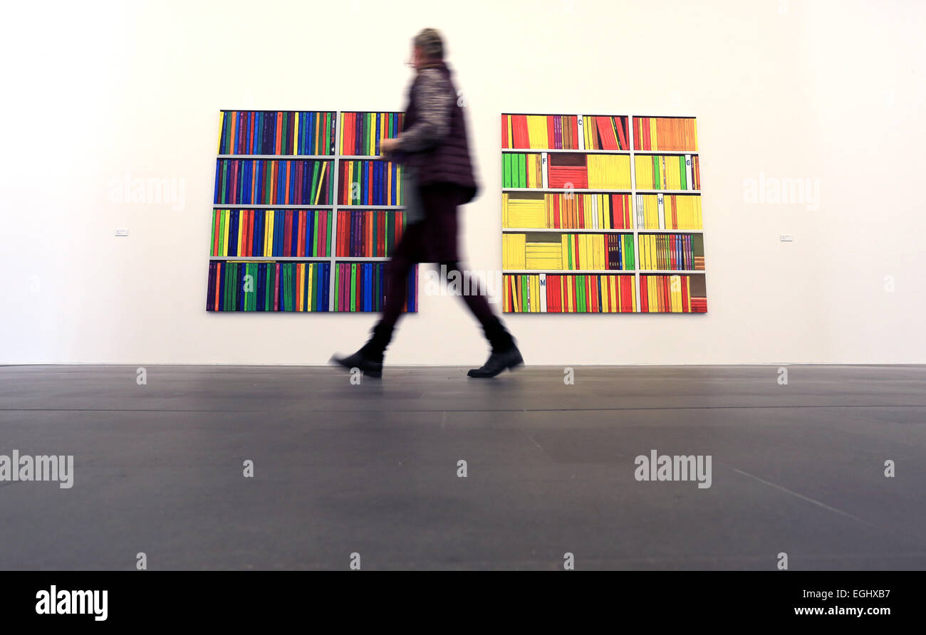 Duisburg, Germany. 25th Feb, 2015. A visitor watches the paintings of ...
