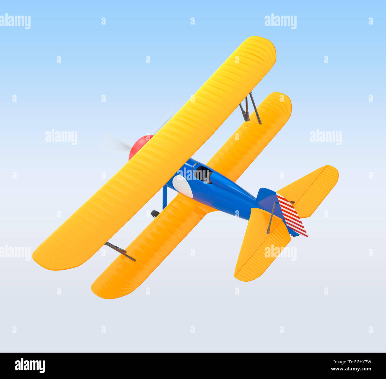 Yellow and blue biplane flying in the sky Stock Photo - Alamy