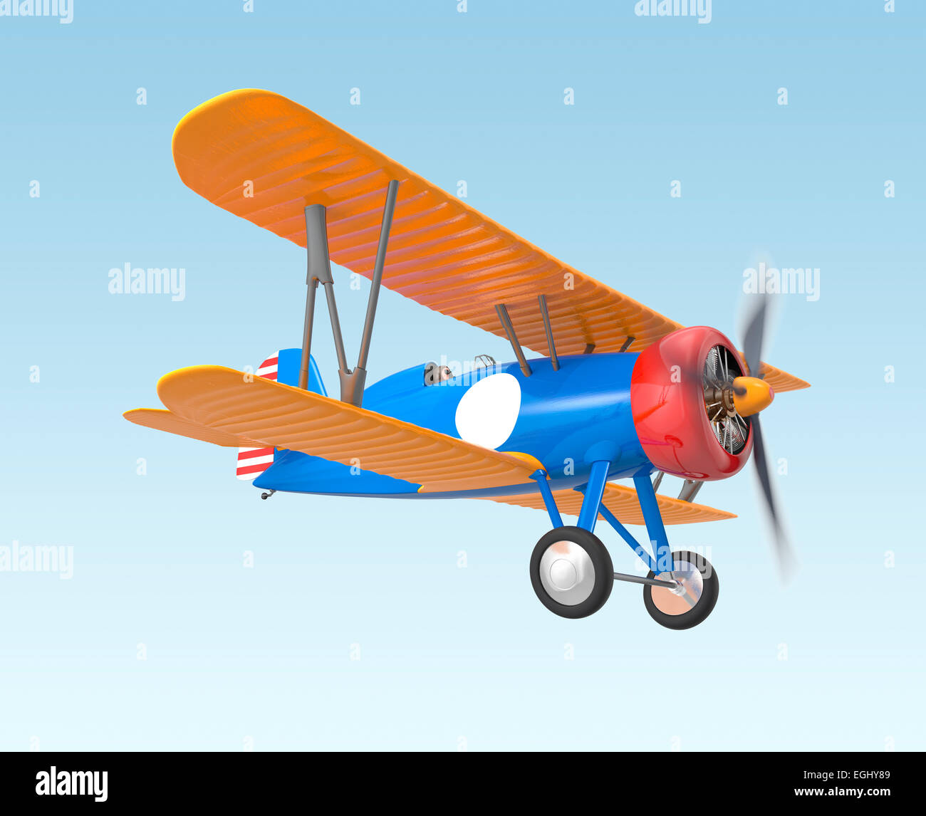 Yellow and blue biplane flying in the sky Stock Photo - Alamy