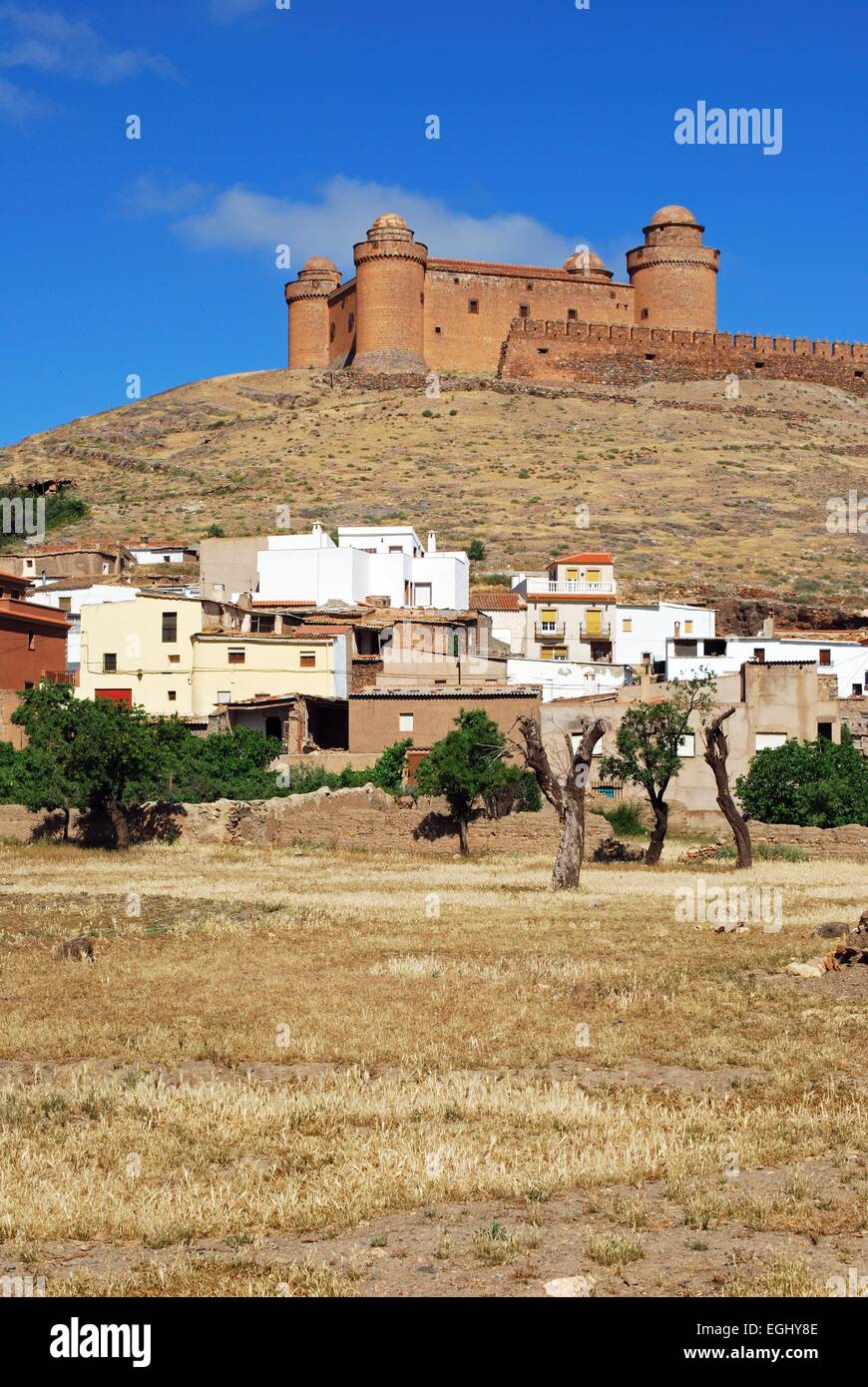 View of the castle (Castillo de La Calahorra) above the white town, La ...