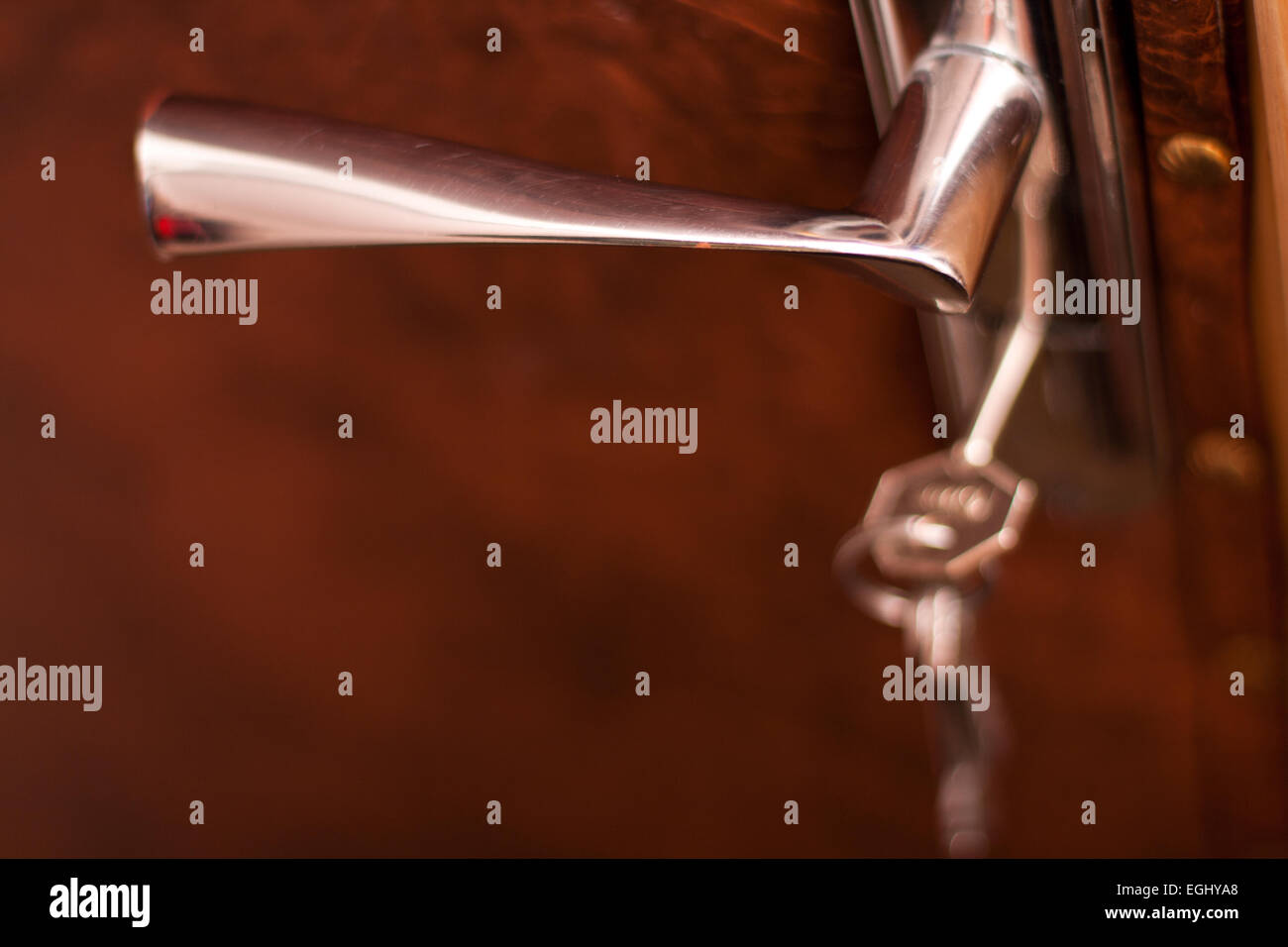 doorhandle close up with keys sticking on keyhole in brown door Stock ...