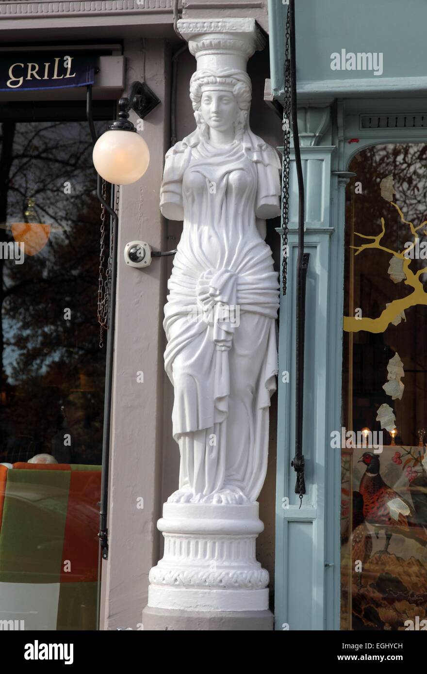 Caryatid statue outside a shop in Montpellier, Cheltenham Stock Photo ...