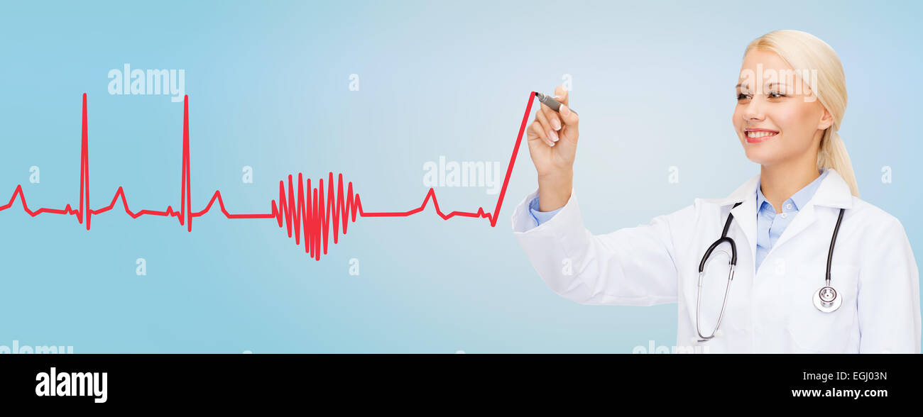smiling female doctor drawing heartbeat cardiogram Stock Photo - Alamy