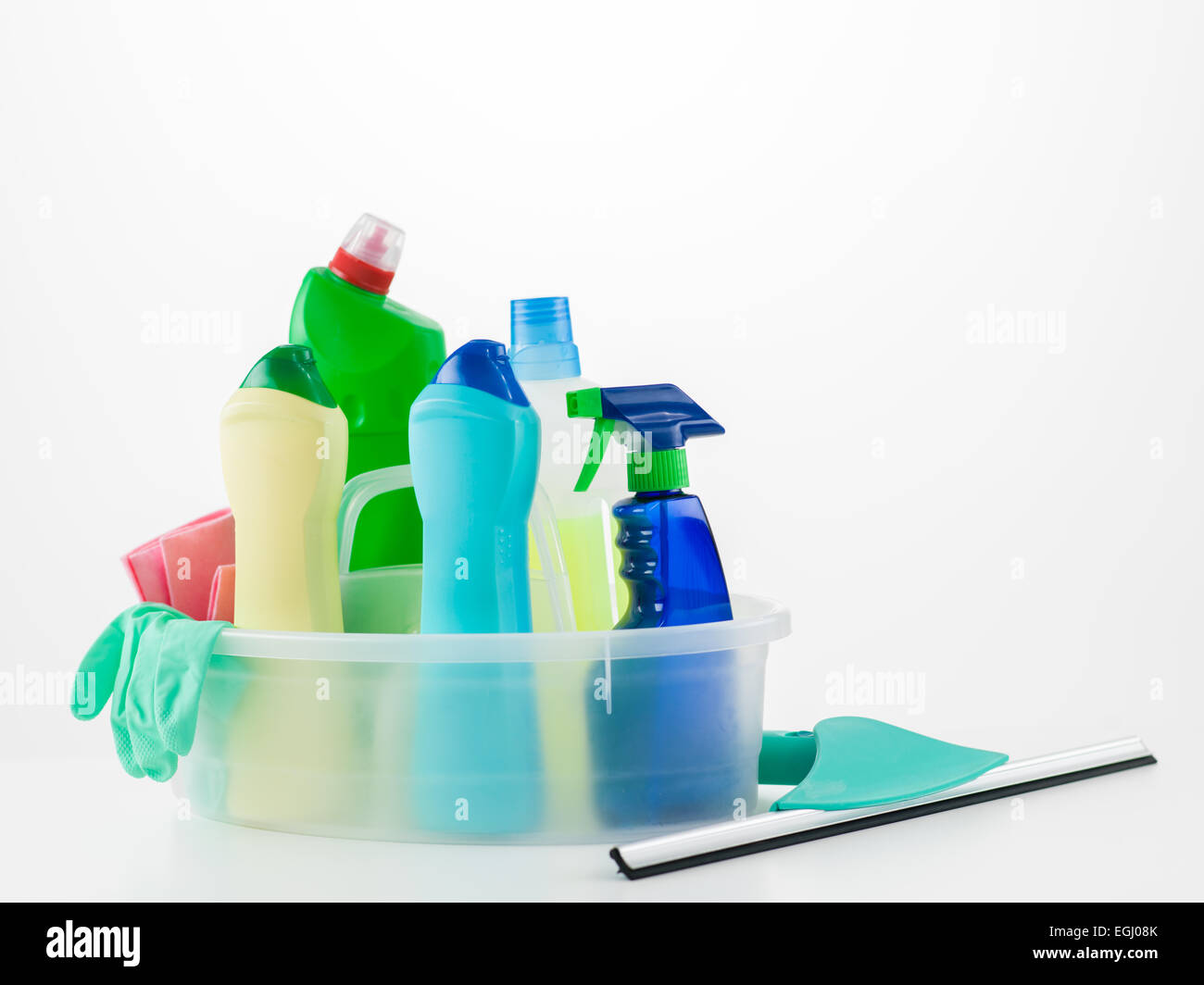cleaning products in basket on white background Stock Photo - Alamy